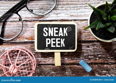 The Phrase Sneak Peek Appearing Behind Torn Paper Stock Photo Image