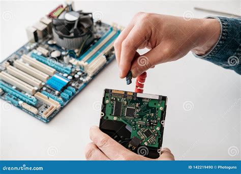 Technician Plugging Ethernet In A Rack Mounted Server Royalty Free Stock Photography