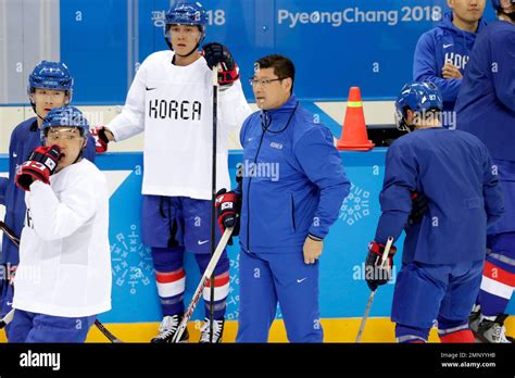 Korea Head Coach Jim Paek Center Stands With His Team During A Work