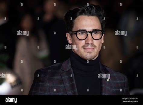 Josh Patterson Poses For Photographers Upon Arrival At The Premiere Of