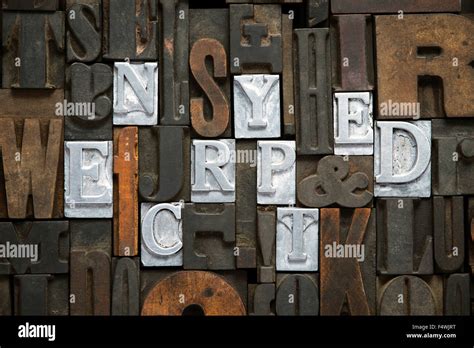 Encrypted Concept Made From Metallic Letterpress Blocks In Mixed Wooden