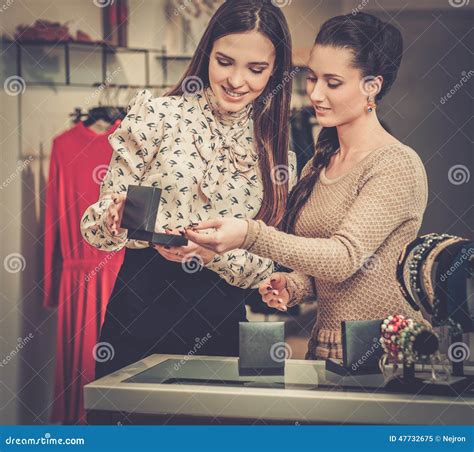 Woman And Shop Assistant In A Showroom Stock Image Image Of Choice