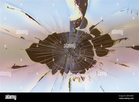 Close Up View Of Physically Damaged Lcd Screen Surface With Impact Spot Radial Cracks Pixel