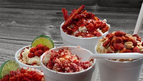 Group Of Mexican Snacks Several Corns In Cups Prepared With Chili Peanuts Chips Chamoy