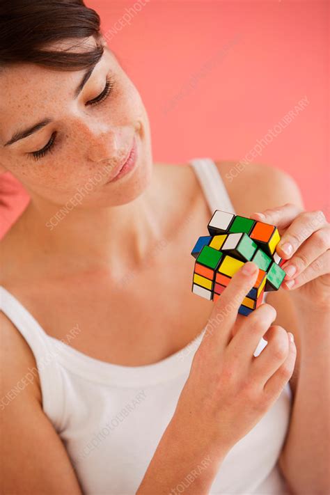 Woman And Rubik S Cube Stock Image C Science Photo Library