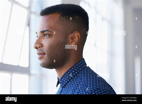 Contemplating His Future Profile Of A Young Ethnic Man Looking