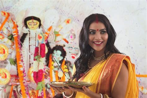 Portrait Of A Beautiful Married Bengali Woman Holding Puja Thali Photo