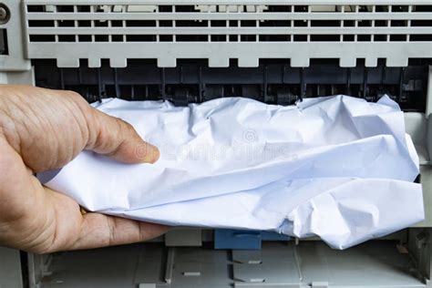Technicians Removing Paper Stuck Paper Jam In Printer At Office Stock