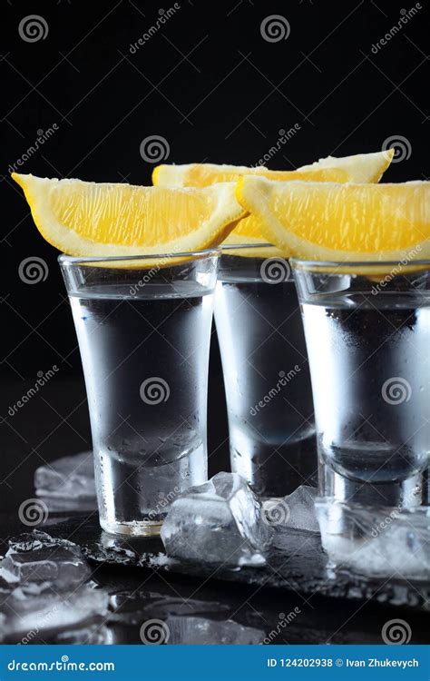 Vodka Shots Glasses With Vodka With Lemondark Stone Backgroundcopy