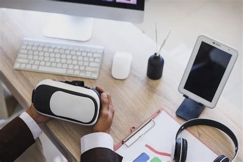 Premium Photo Closeup Of Hands Holding Vr Glasses At Office Desk For
