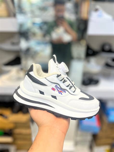 خرید کفش کتانی اسپرت قرقره ای بچه گانه مناسب روزمره ریبوک شاپینو