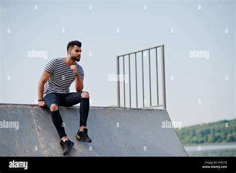 Handsome Tall Arabian Beard Man Model At Stripped Shirt Posed Outdoor