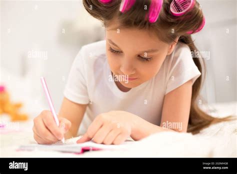 Girl Writing In Her Notebook In Bed Stock Photo Alamy