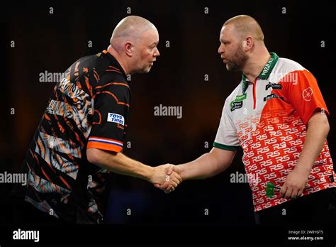 Raymond Van Barneveld Celebrates Victory Over Radek Szaganski Right