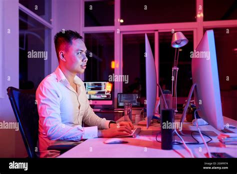 Positive Software Developer Working On Computer At Office Table Pink
