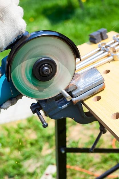 Premium Photo Person Using Angle Grinder