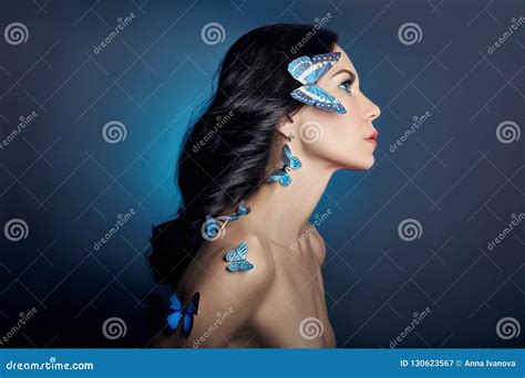 Beautiful Mysterious Woman With Butterflies Blue Color On Her Face