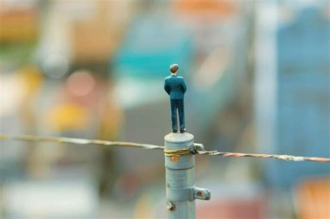 A Small Figure On A Wire With A Number Of Numbers 1 On It Premium Ai
