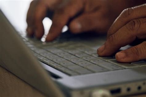 Premium Photo Close Up Of Fingers Typing On Silver Laptop Keyboard