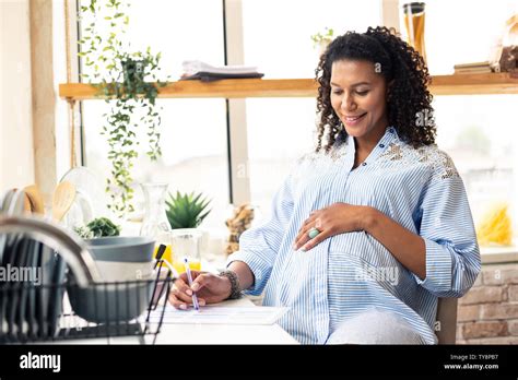 Hand pregnant belly holding african hi-res stock photography and images - Alamy