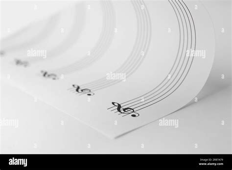 Sheet With Empty Staves For Music Notes And Treble Clef On White