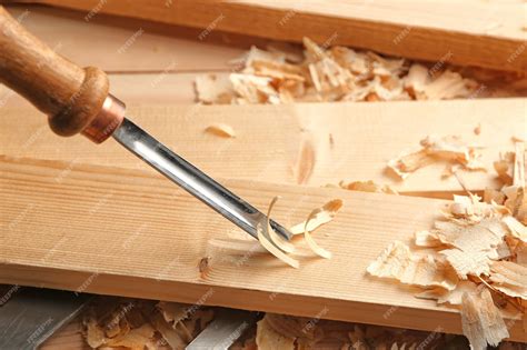 Premium Photo Working With Chisel And Wooden Board In Carpenters