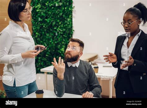 Team Leader Analyzing Sales Data Statistics Or Explaining Marketing