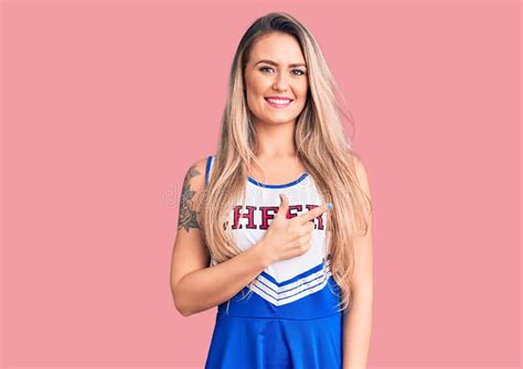 Young Beautiful Blonde Woman Wearing Cheerleader Uniform Cheerful With