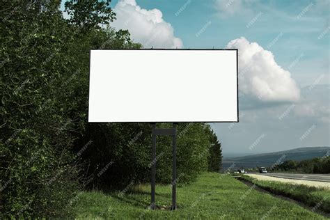 Premium Photo Empty Billboard For Advertising Poster Near Asphalting Road And Green Forest On