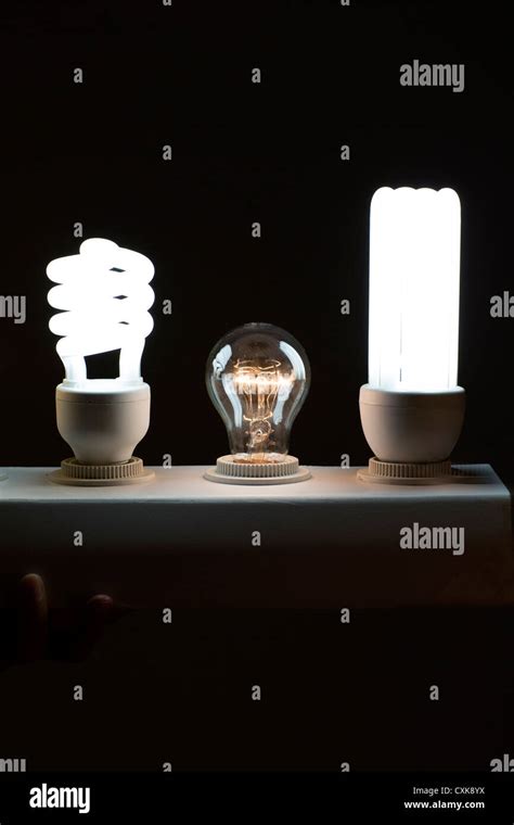 Three Energy Efficient Lightbulb In A Row Stock Photo Alamy