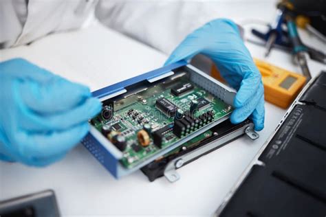 computer hardware repair and hands of engineer working on electronic
