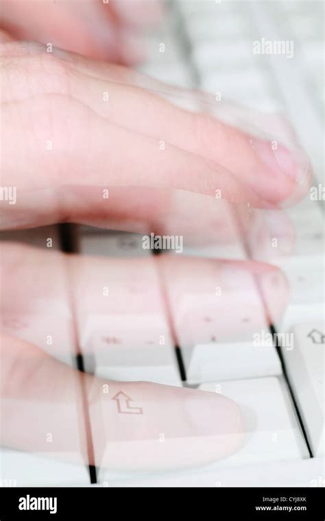 Hand Typing Fast On A Keyboard With A Lot Of Motionblur Stock Photo Alamy