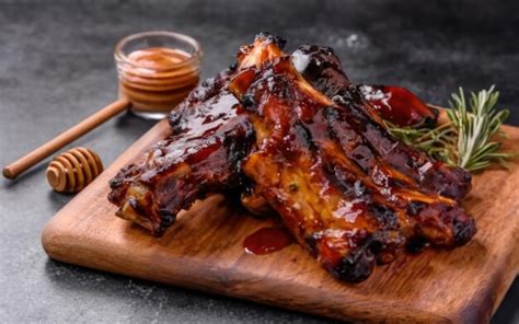 Closeup Of Pork Ribs Grilled With Bbq Sauce And Caramelized In Honey
