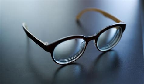 Premium Photo A Pair Of Reading Glasses Are On A Table