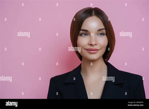 Sophisticated Young Woman With Sleek Hair In A Navy Blazer Poised And