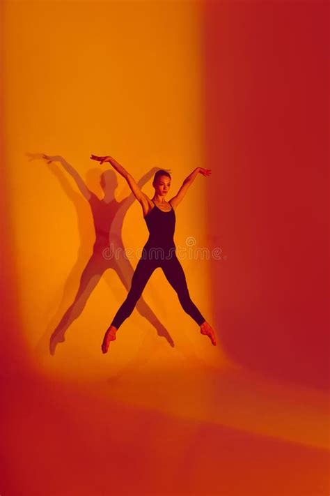 Flexible Elegance Portrait Of Graceful Dancer Poses In Black Sports