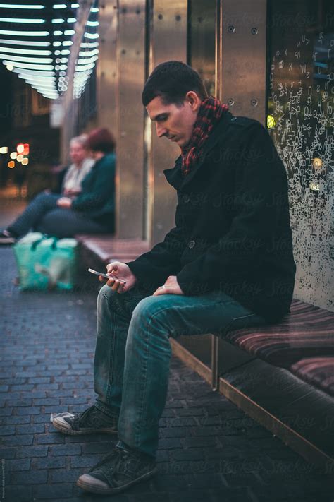 Man Waiting For The Bus At Night By Stocksy Contributor Mosuno