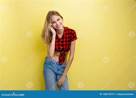 Joyful Beautiful Young Blond Girl With Blue Eyes Wearing Red Checkered