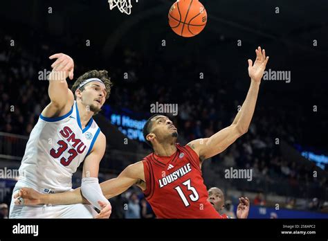 Louisville Center Frank Anselem Ibe 13 And Louisville Guard Aidan Mccool 33 Reach For The