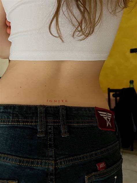 Ignite Low Back Tattoo In 2023 Back Tattoo Women Creative Tattoos