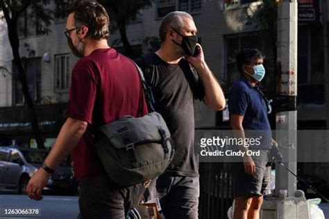Passing On Sidewalk Photos And Premium High Res Pictures Getty Images