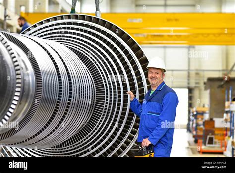 Workers Assembling And Constructing Gas Turbines In A Modern Industrial