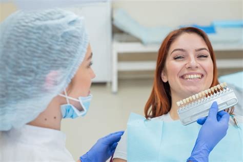 Premium Photo Check And Select The Color Of The Teeth In The Dentist