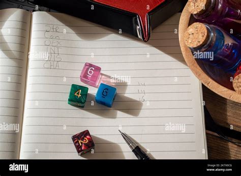 Close Up Image Of 4 Colorful Dice Used To Role For Table Top Rpg