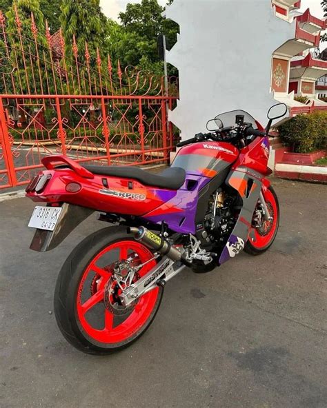 Motorcycle Parked In Front Of Building