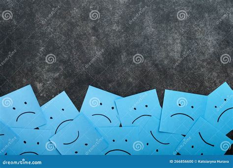 Blue Sticky Notes Blank With Drawing Sad Face On Black Background With Copy Space Ready For Your