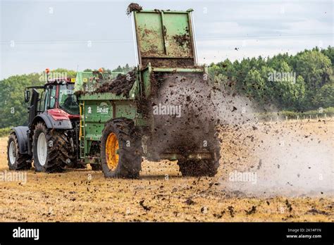 Modern Agriculture Muck Spreading Prior To Ploughing Stock Photo Alamy