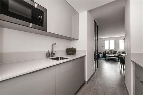 Premium Photo Kitchen With Gray Gloss Wood Cabinets Smooth White