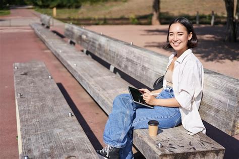 Premium Photo Portrait Of Asian Girl Sits On Bench In Park Draw On