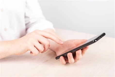 Premium Photo Woman Forefinger Clicking Ok Button At Phone Female